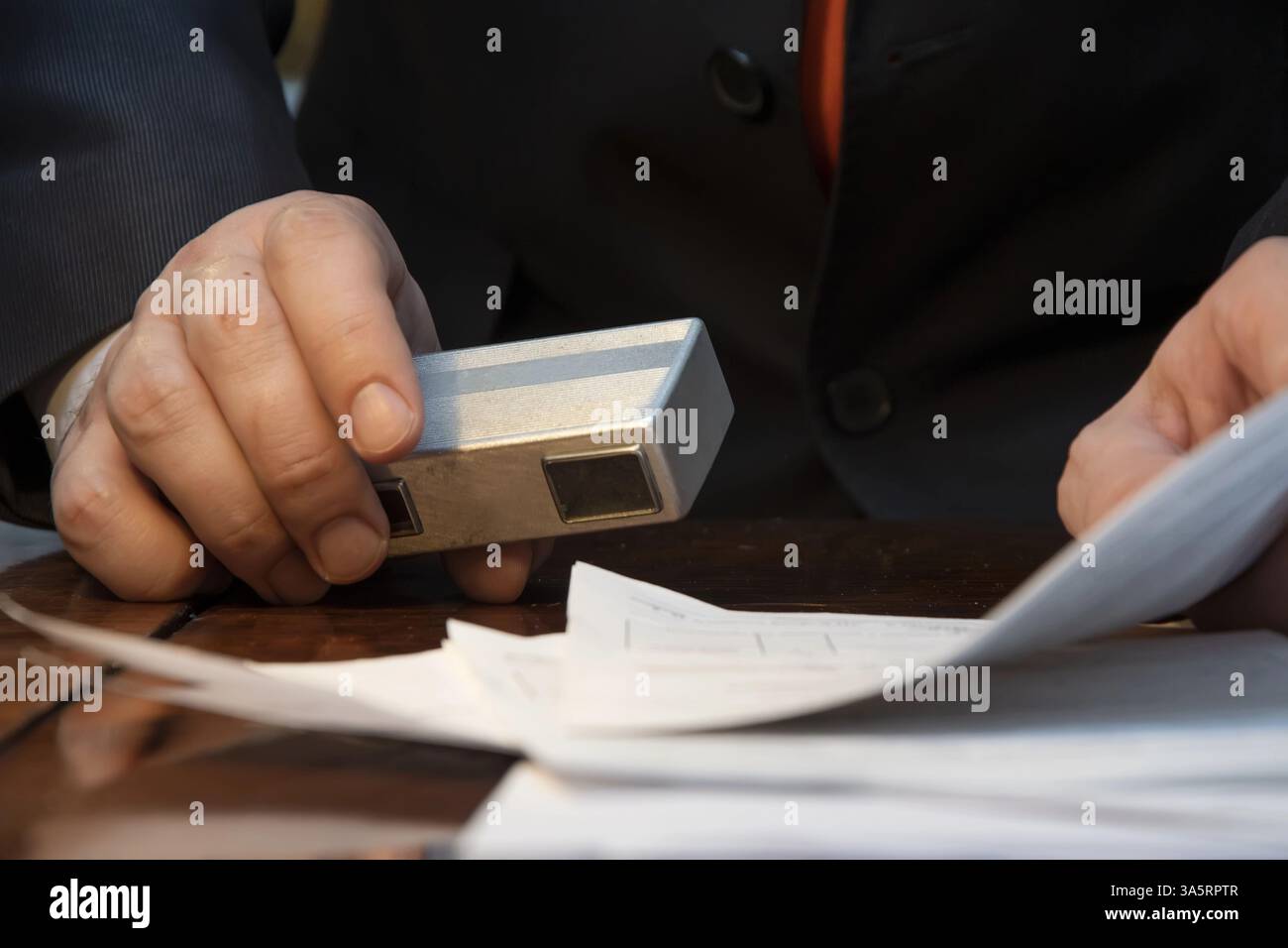 Spy photographs secret materials on a mini camera, collecting ...