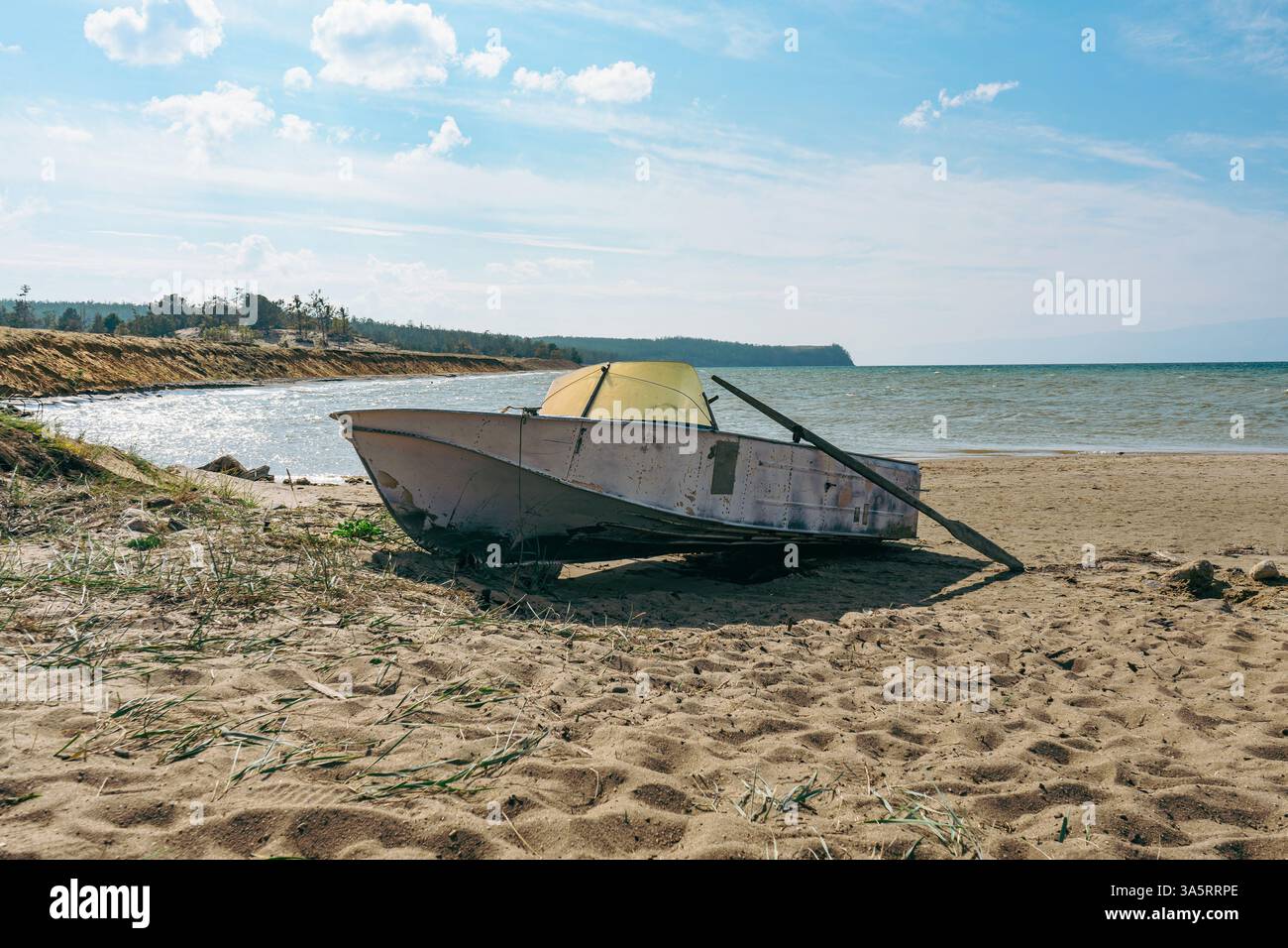 Old paddle boat stands on sand, Baikal lake shore Stock Photo - Alamy
