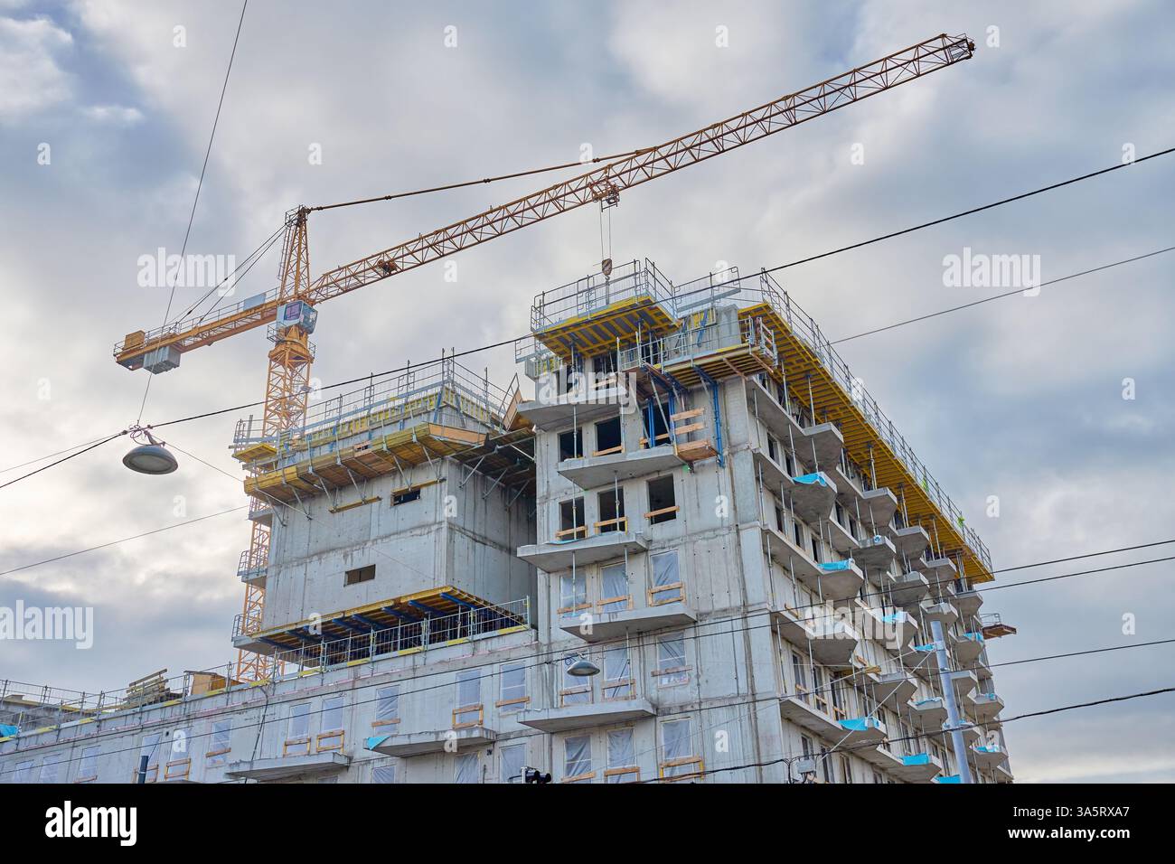 Unfinished concrete multi story building under construction with ...