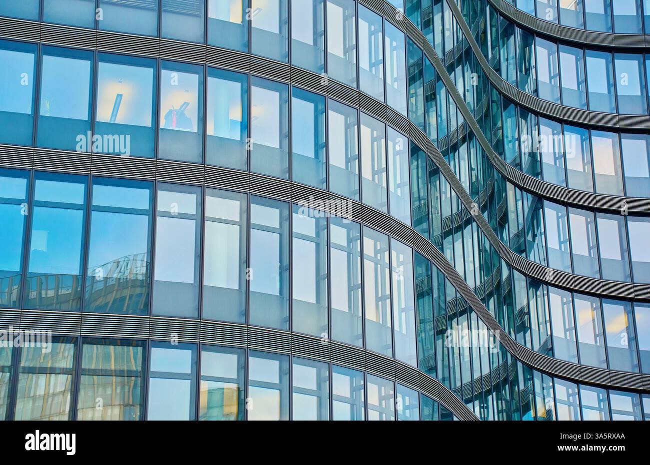 Modern curved high rise building. Glass facade of skyscraper. Office ...