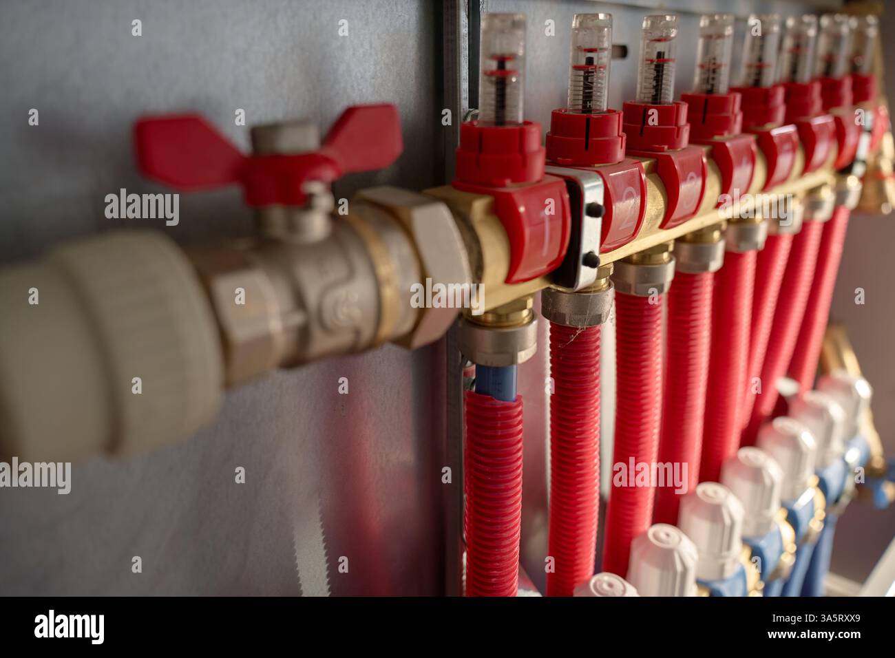 Underfloor heating manifold with control valves, flow meters and ...