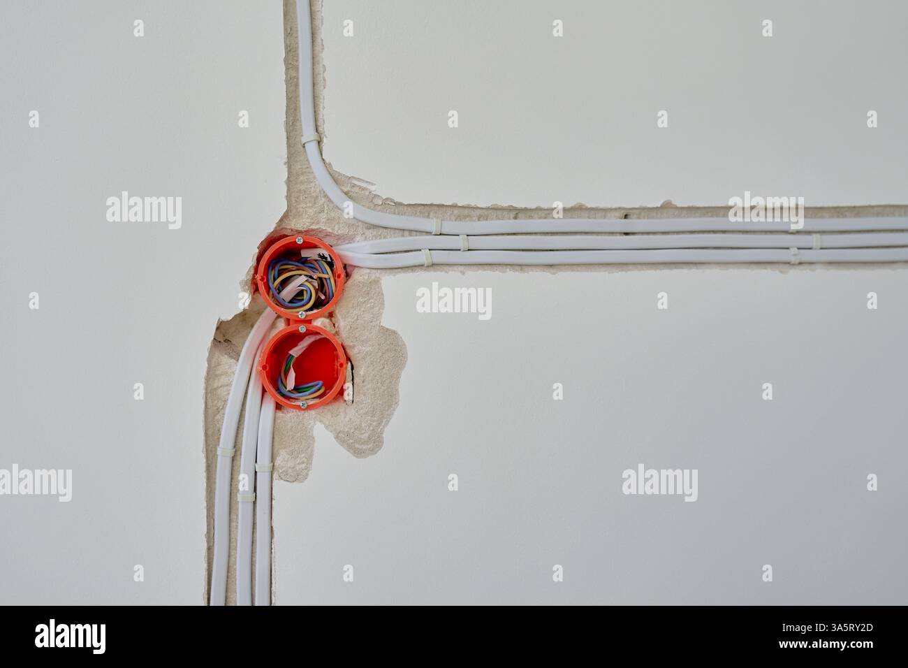 Electrical wiring installation during renovation. Plastic outlet boxes ...