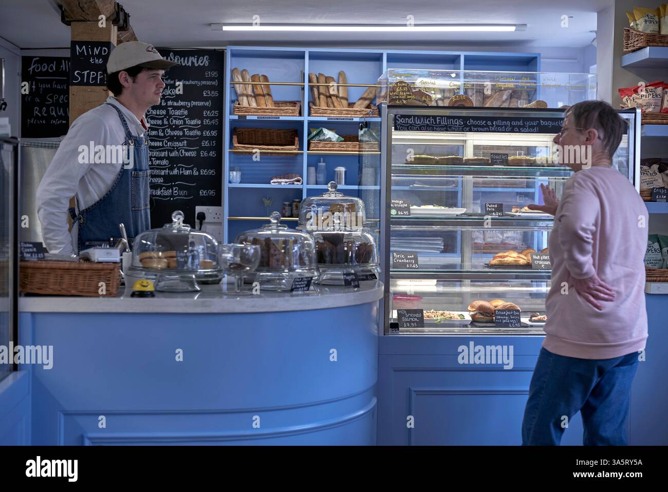 Cake shop interior with staff serving customer. Stratford upon Avon ...