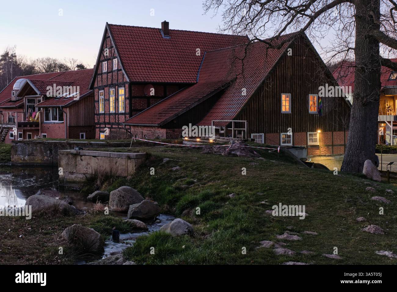 Historic half-timbered German watermill with mill dam, works and mill ...