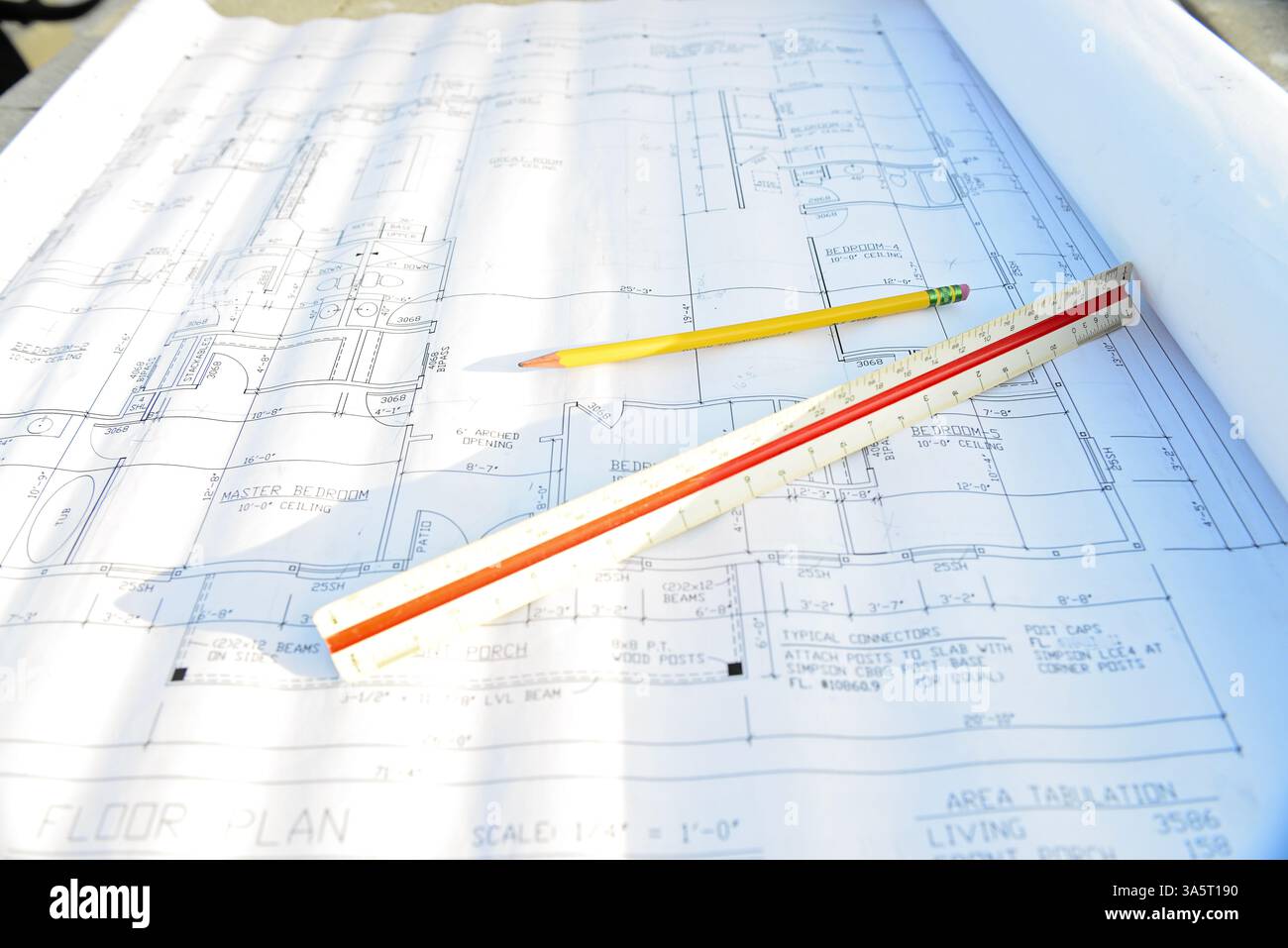 Architectural blueprint with a pencil and scale ruler on a work Stock ...