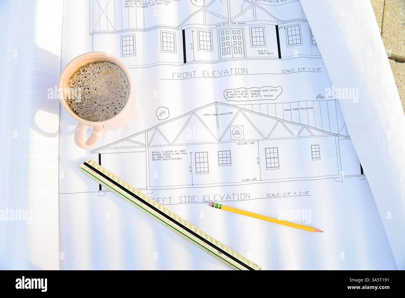 Blueprint with coffee, ruler, and pencil on a construction plann Stock ...