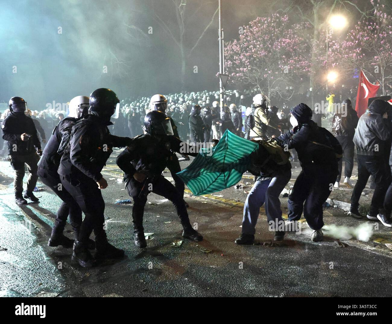 A protester towards riot police during a protest after Istanbul's Mayor ...