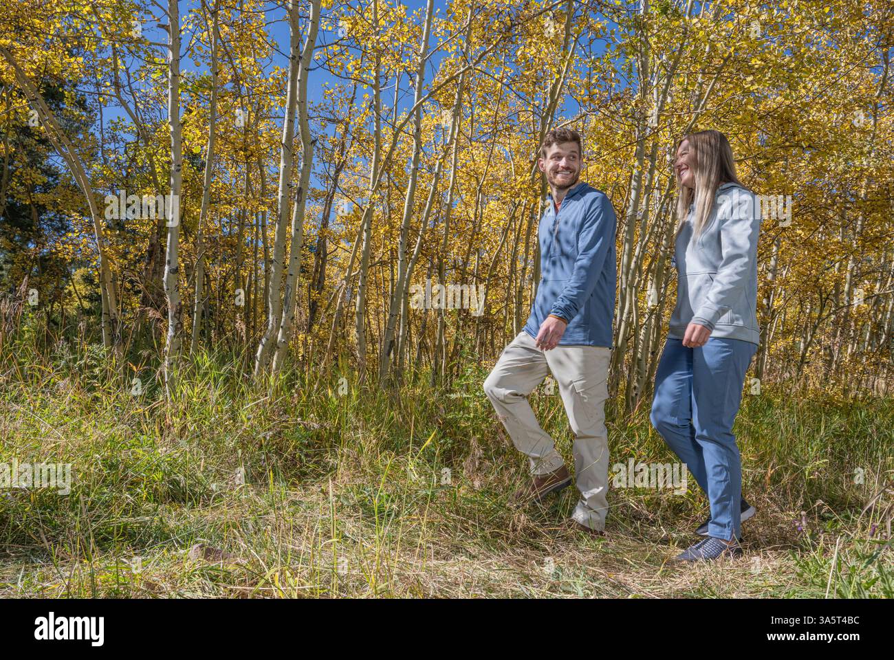 Man and woman hike in Colorado Fall Stock Photo - Alamy