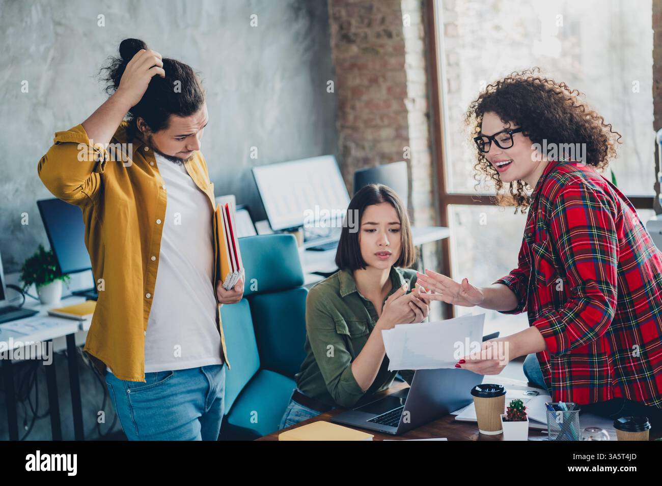 Young creative professionals collaborating in a modern office ...
