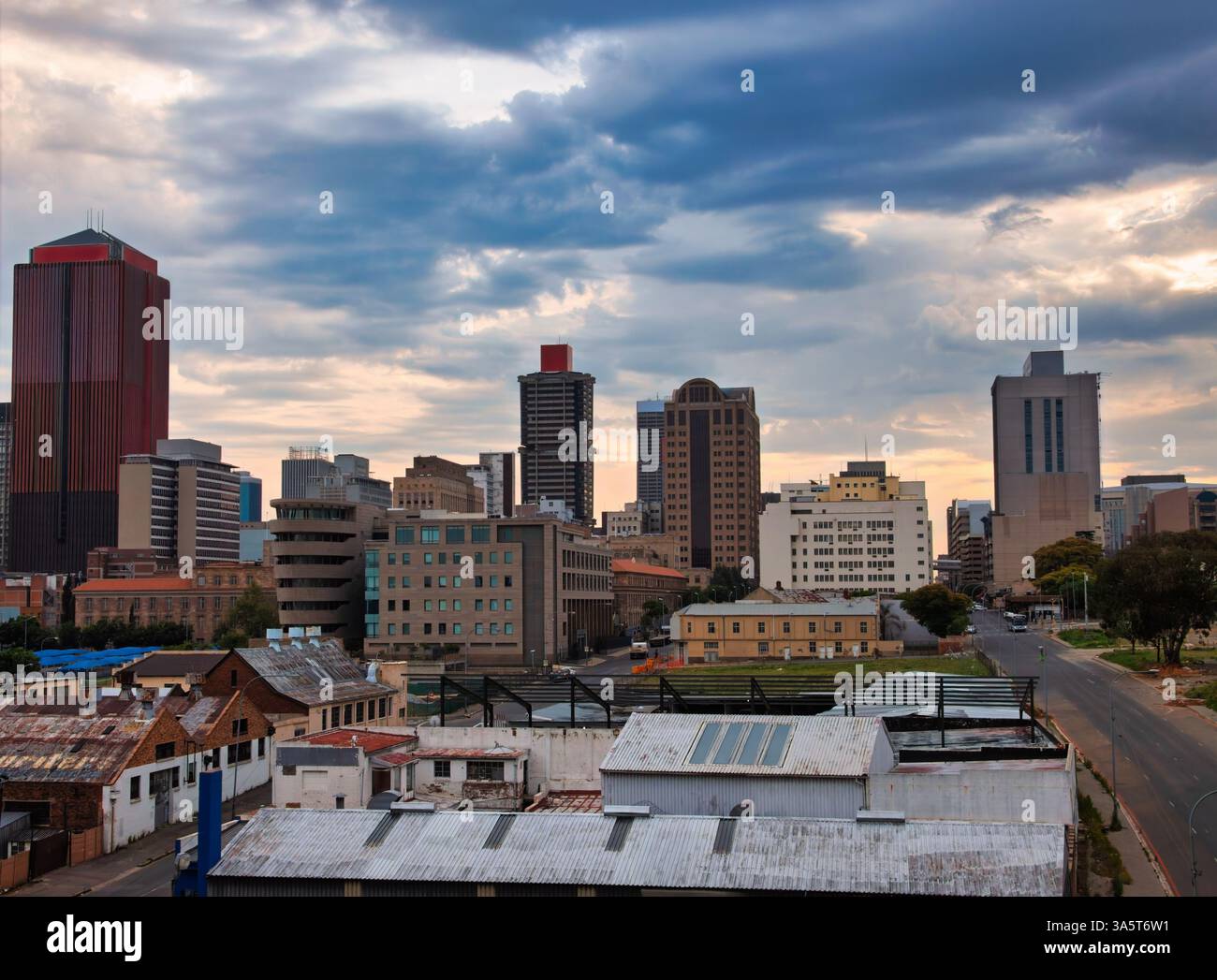 sunset over city skyline in Johannesburg. surrounded by downtown ...