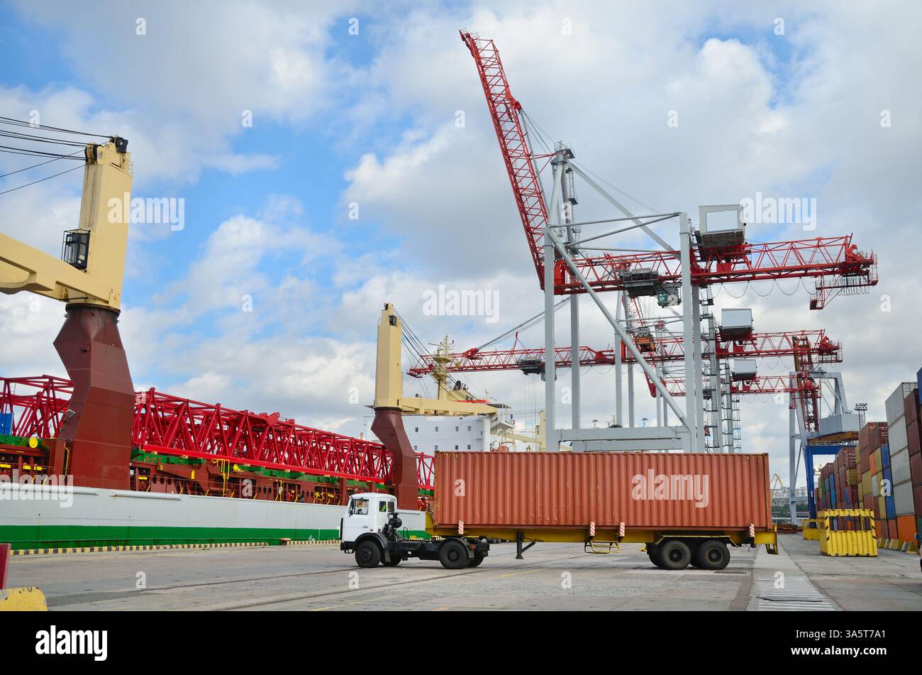 Truck in container terminal in a harbor Stock Photo - Alamy