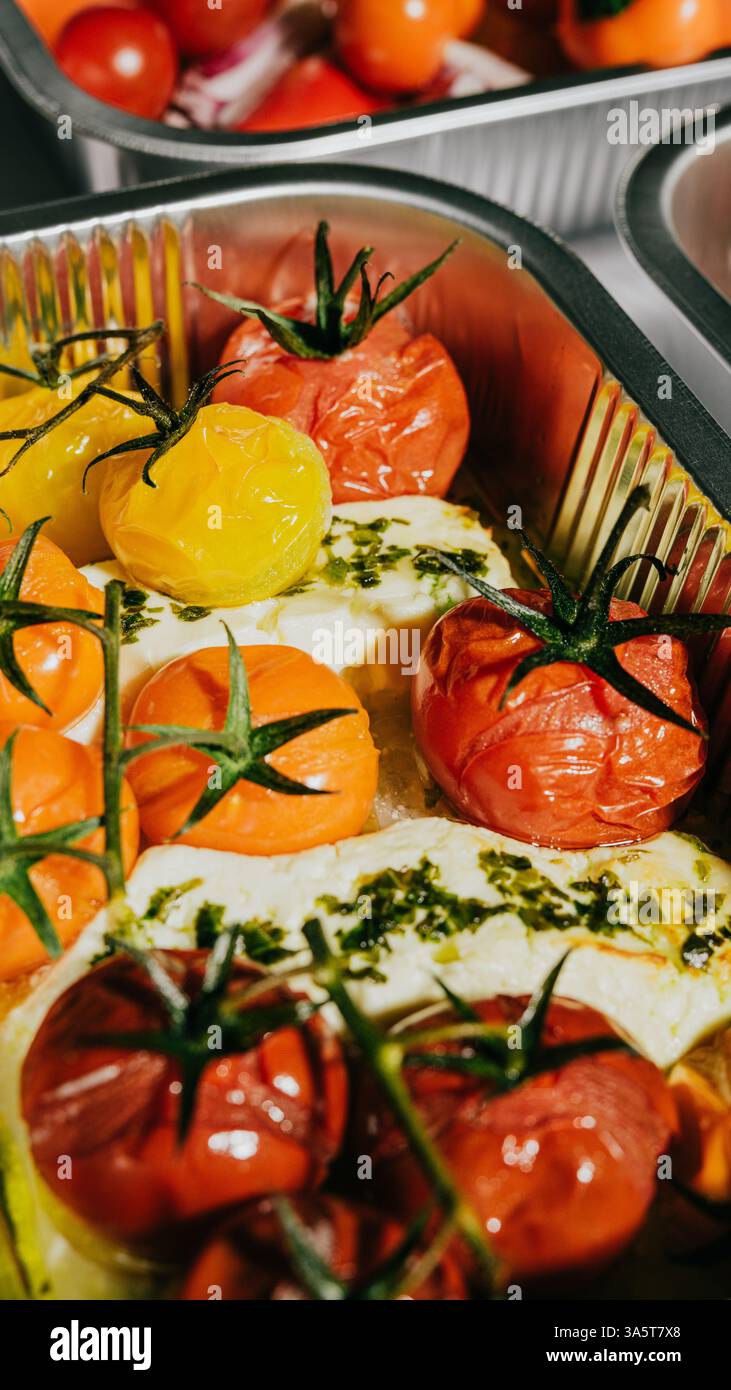 A tray of assorted vegetables including tomatoes and carrots. The tray ...