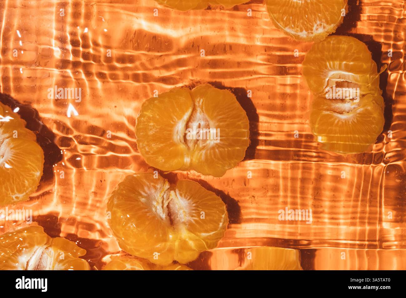 Peeled fresh mandarin halves in water, splash water, top view Stock ...