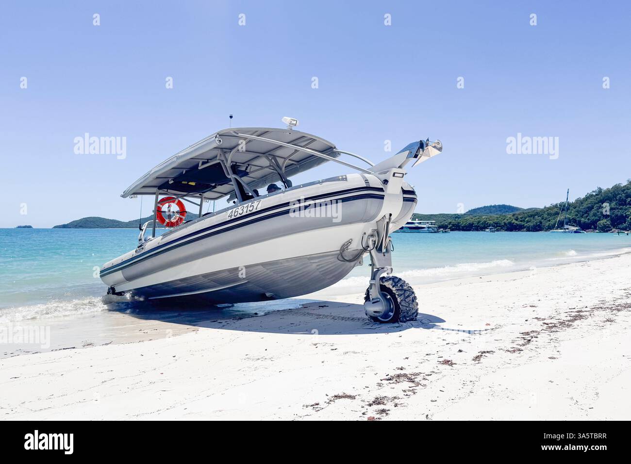 Boat on wheels standing at unique famous Whitehaven Beach. Modern ...