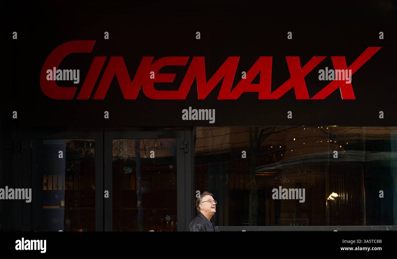 Berlin, Germany. February 23, 2025. A person walks by CINEMAXX cinema ...