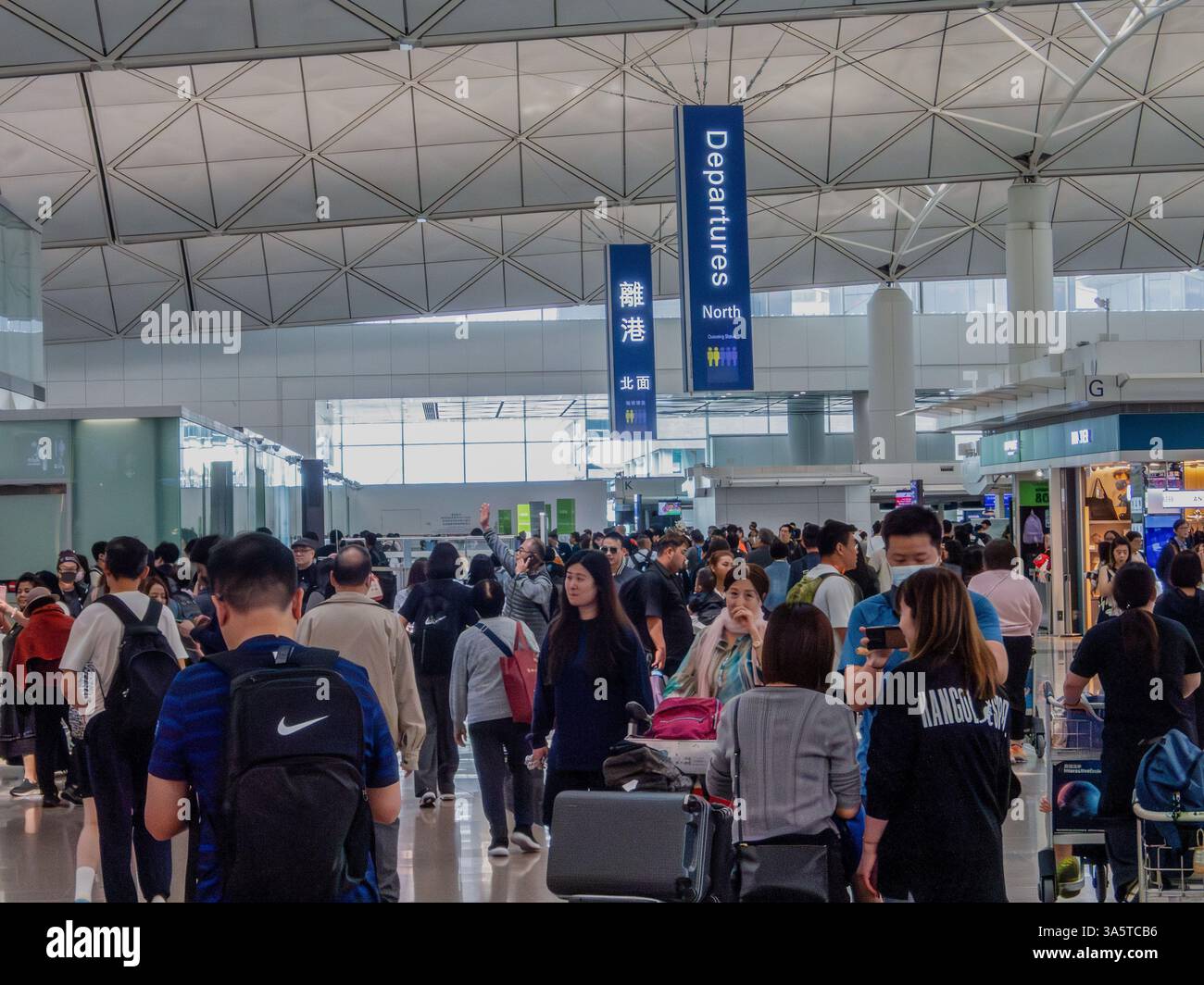 Hong Kong, China. 23rd Mar, 2025. Passengers are seen in the departure hall at Hong Kong ...