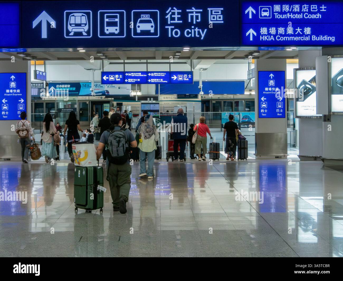 Hong Kong, China. 23rd Mar, 2025. Flight passengers are seen walking to the mass transit system ...