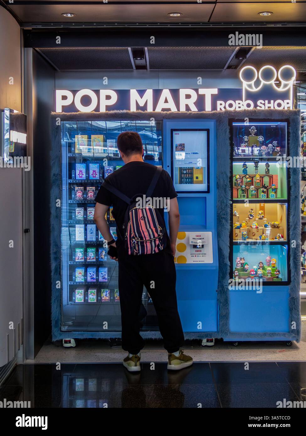 Hong Kong, China. 23rd Mar, 2025. A passenger is seen selecting items from the kiosk at the Pop ...