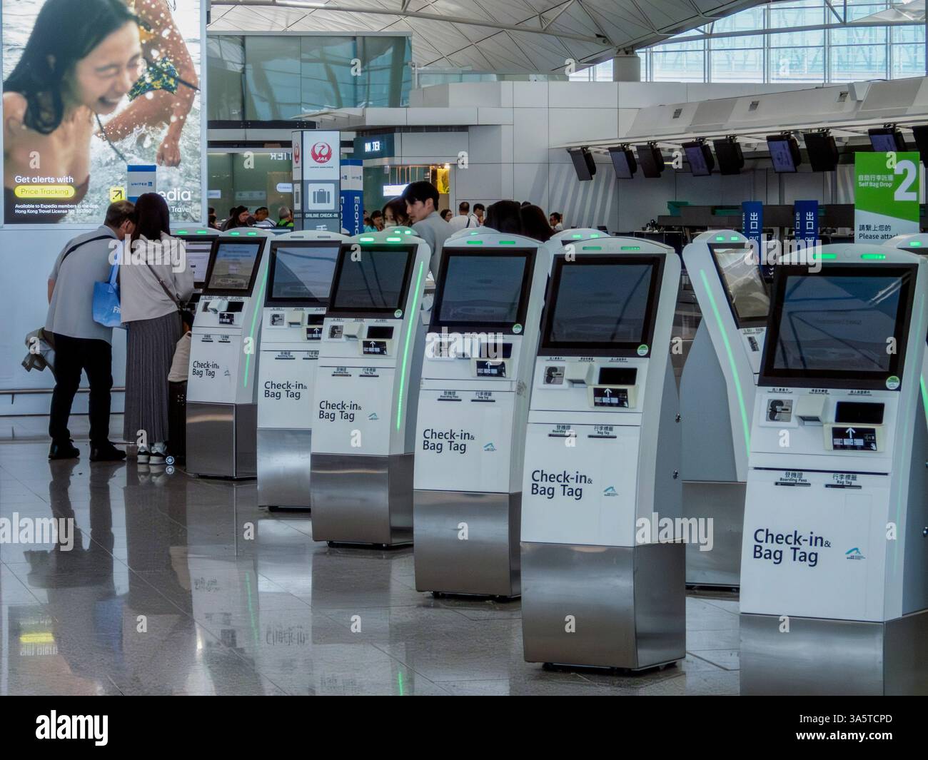 Hong Kong, China. 23rd Mar, 2025. Passengers are seen using the Self Check-In Kiosk and Self Bag ...