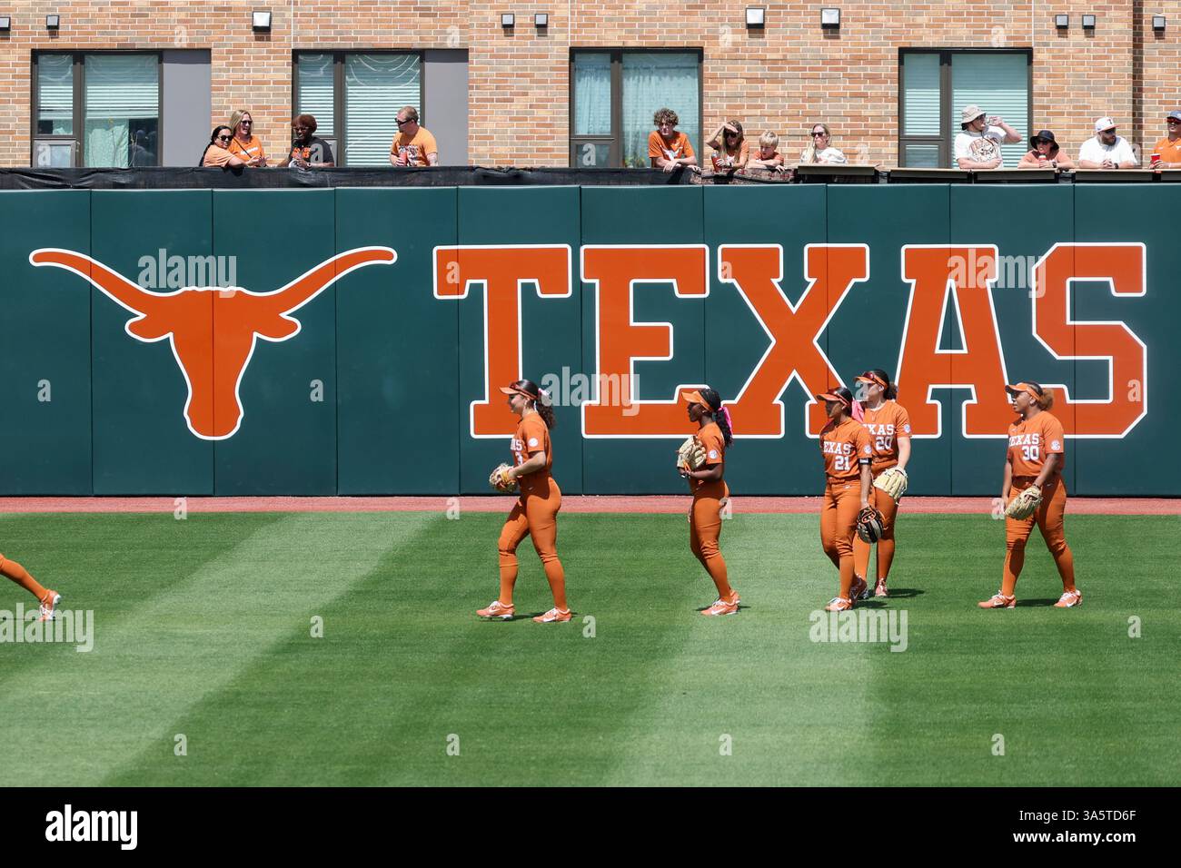 AUSTIN, TX - MARCH 22: Texas players warm up in front of the Texas and ...