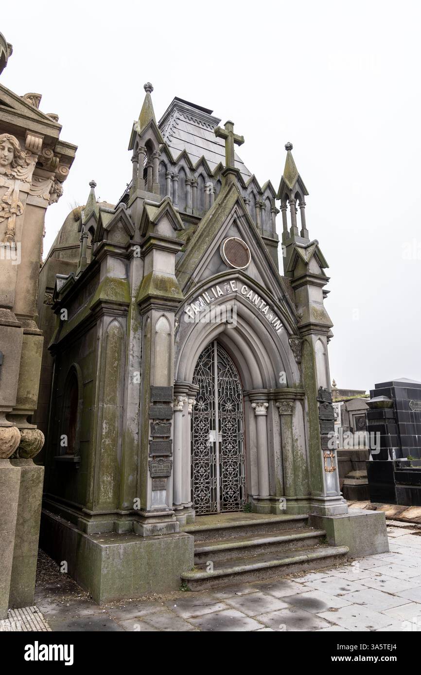 Elegant mausoleums in a historic cemetery with detailed stonework and ...