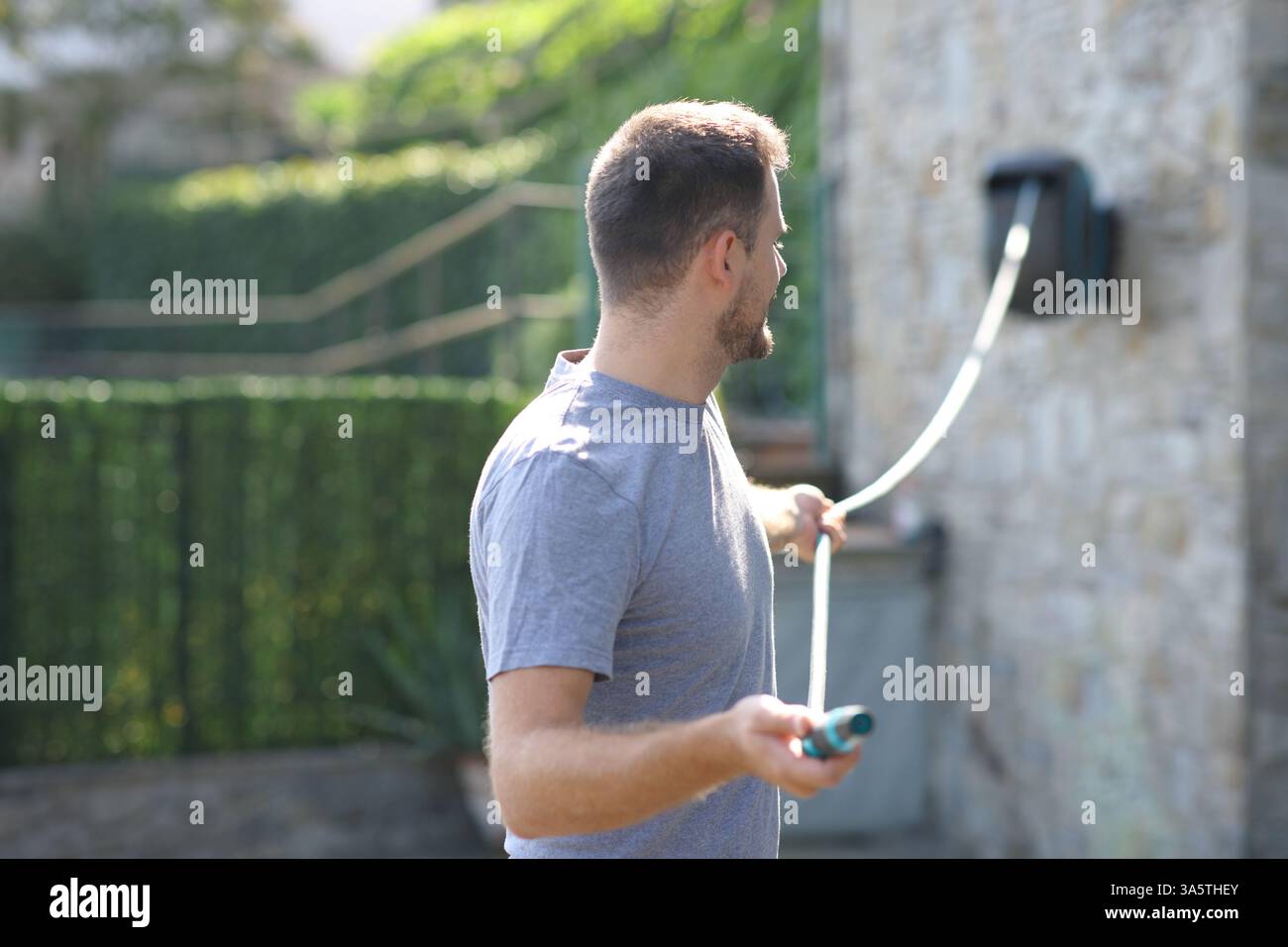 Man hose tap garden hi-res stock photography and images - Alamy