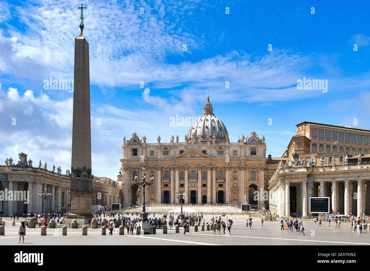 Visitors flock to St Peter's Square, admiring the grand architecture ...