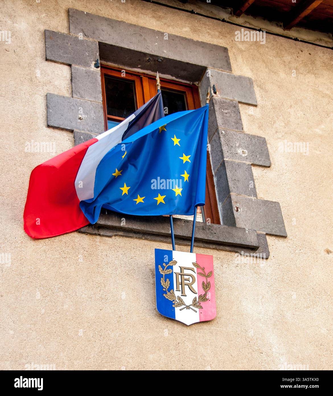 Flags of France and the European Union displayed on a window with an ...