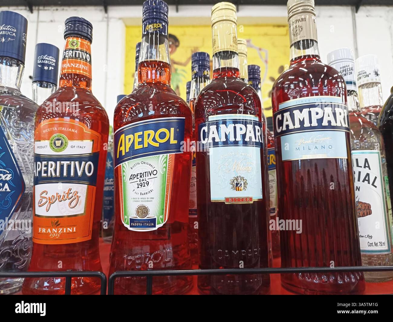 Selection of aperitivo bottles including aperol and campari in liquor ...