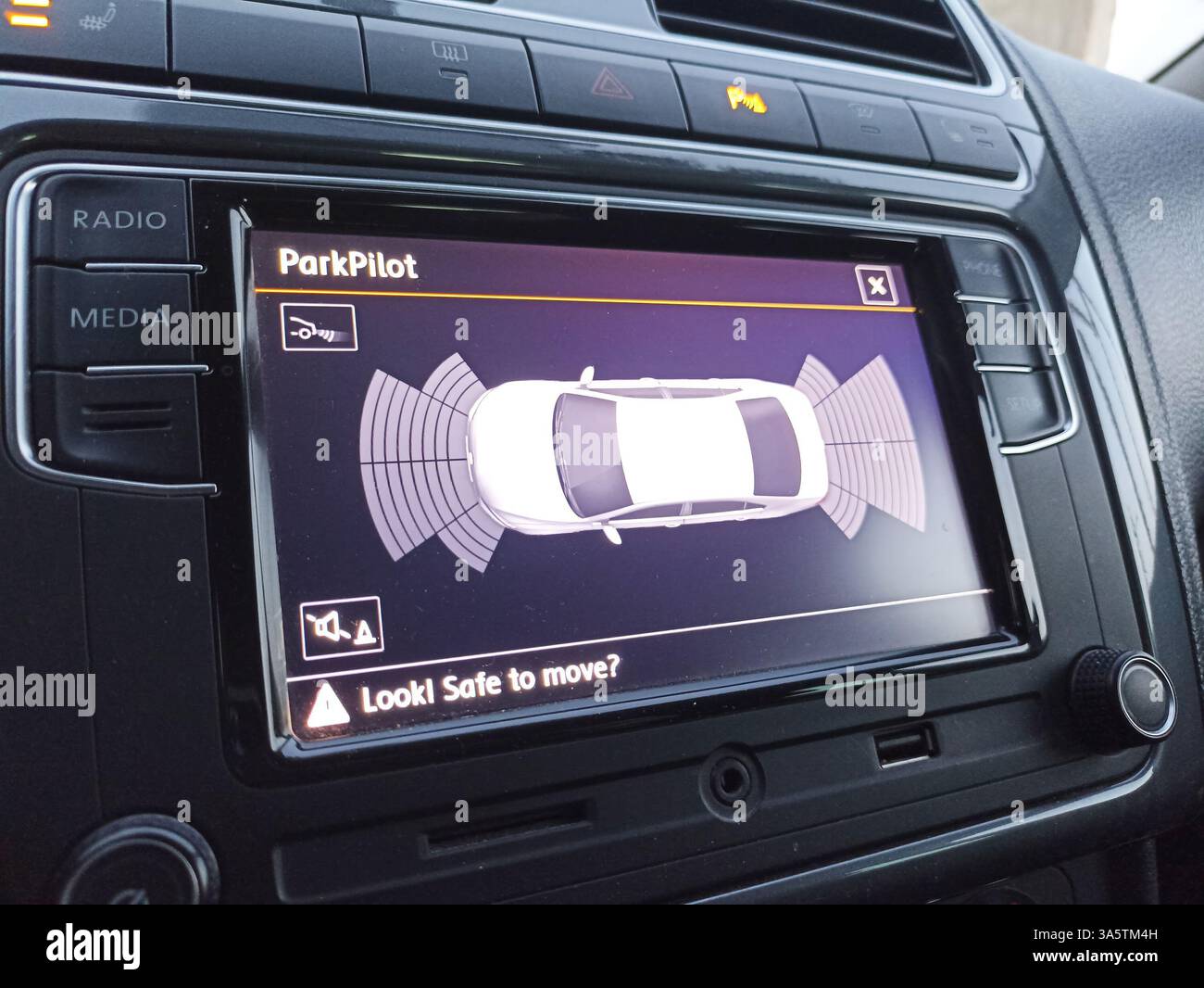 Car dashboard display showing parking sensor with parkpilot ...