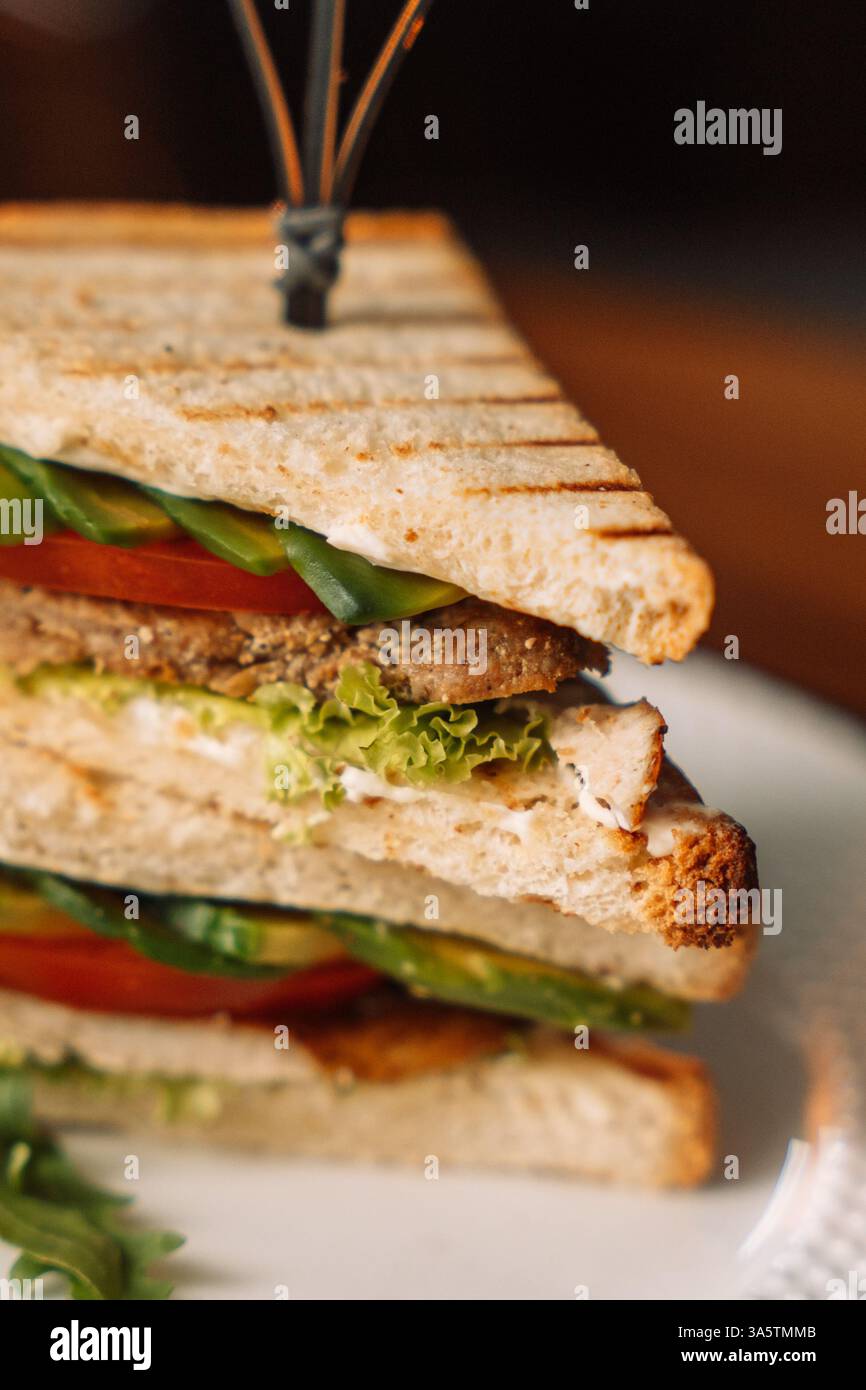 Grilled Meat and Tomato Triangle Sandwiches Stock Photo - Alamy
