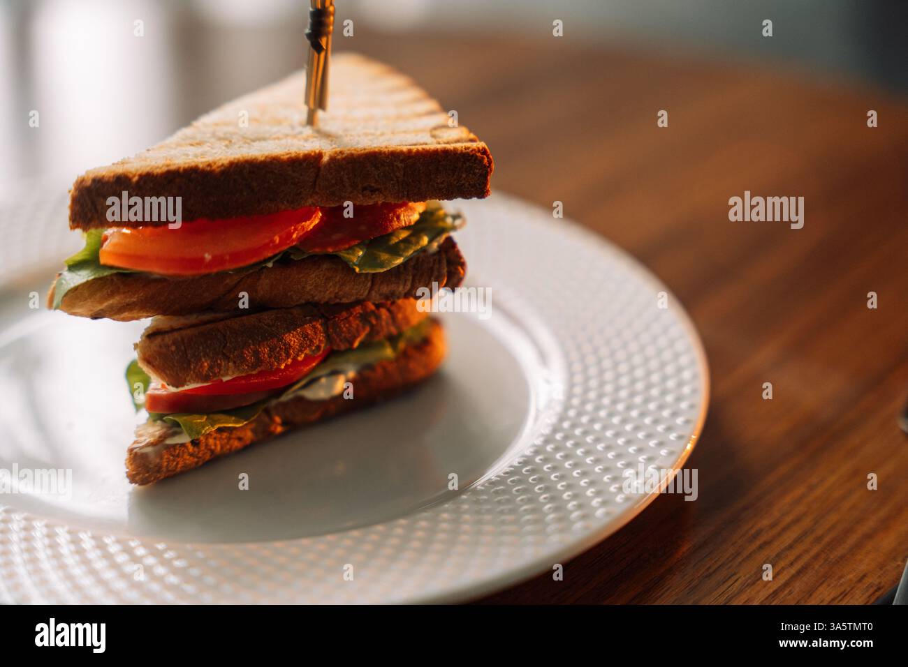 Grilled Ham and Tomato Triangle Sandwiches Stock Photo - Alamy