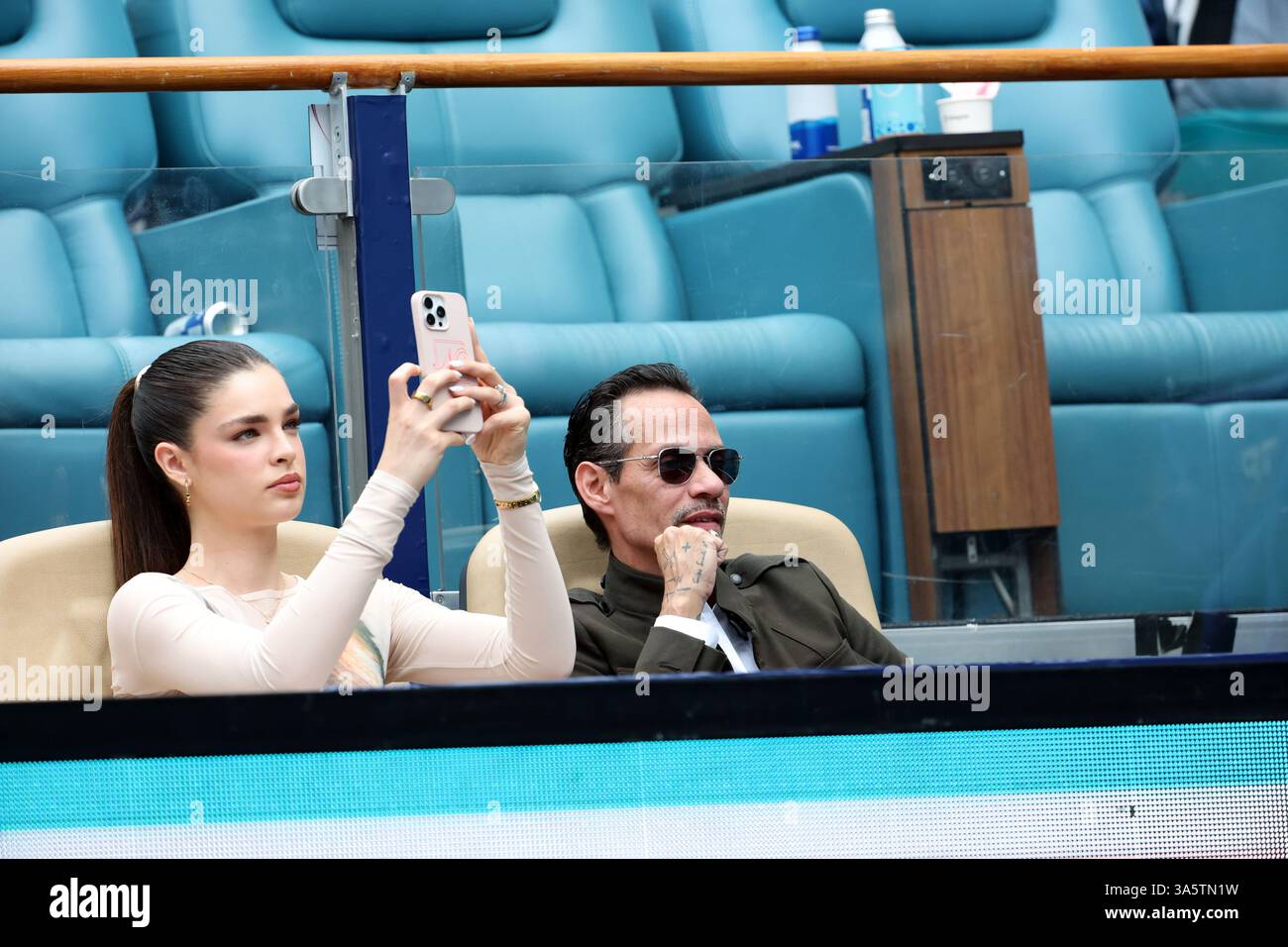 MIAMI GARDENS, FLORIDA - MARCH 23: Marc Anthony and his wife Nadia Ferreira attend the match ...