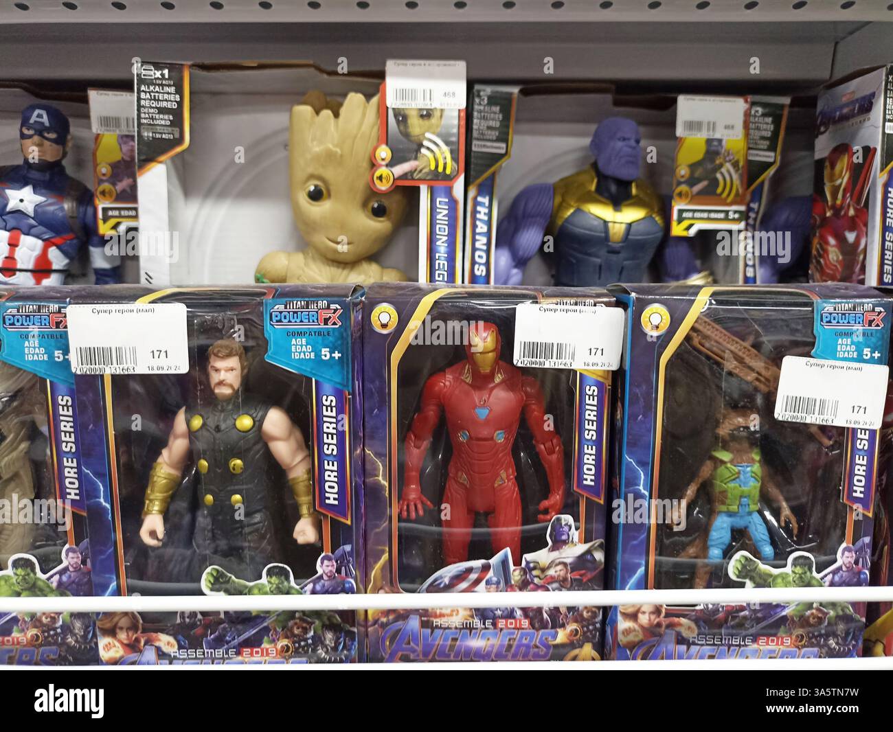 Superhero action figures display with mixed characters in store Stock ...