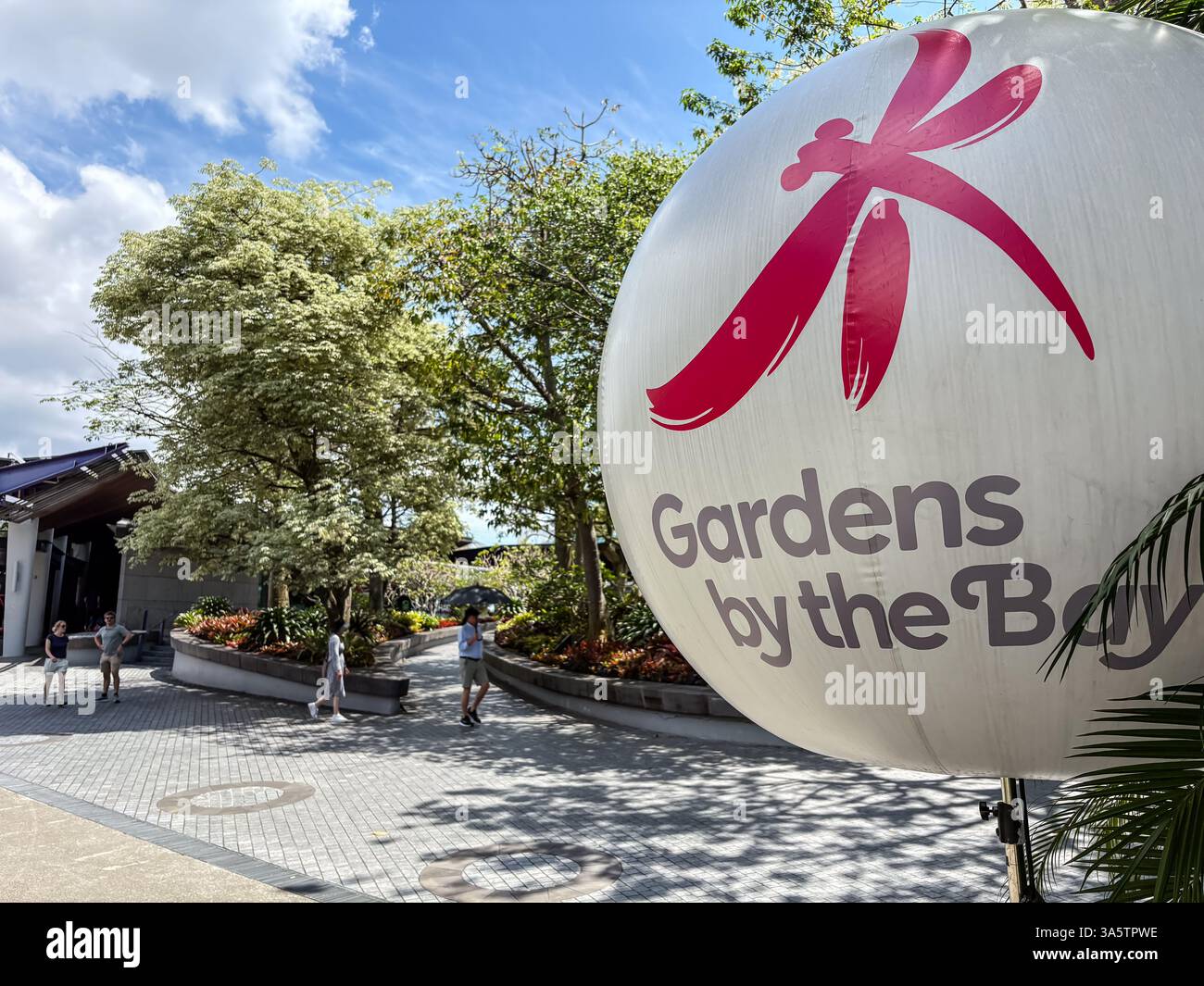 Gardens by the bay signage with people in the background. Gardens by ...