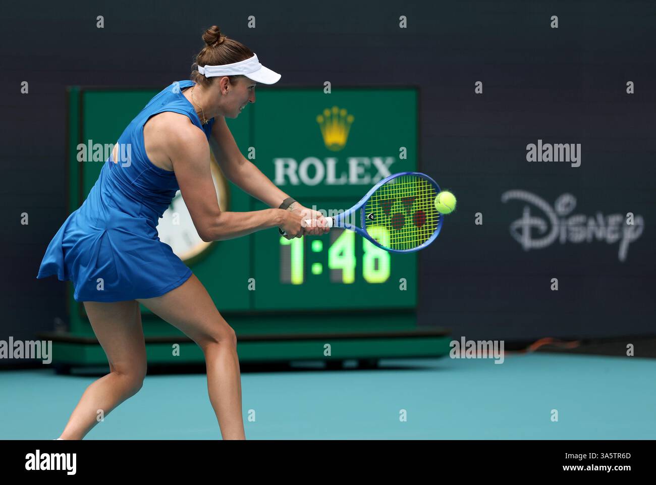 MIAMI GARDENS, FLORIDA - MARCH 23: Iga Swiatek of Poland defeats Elise Mertens of Belgium in the ...