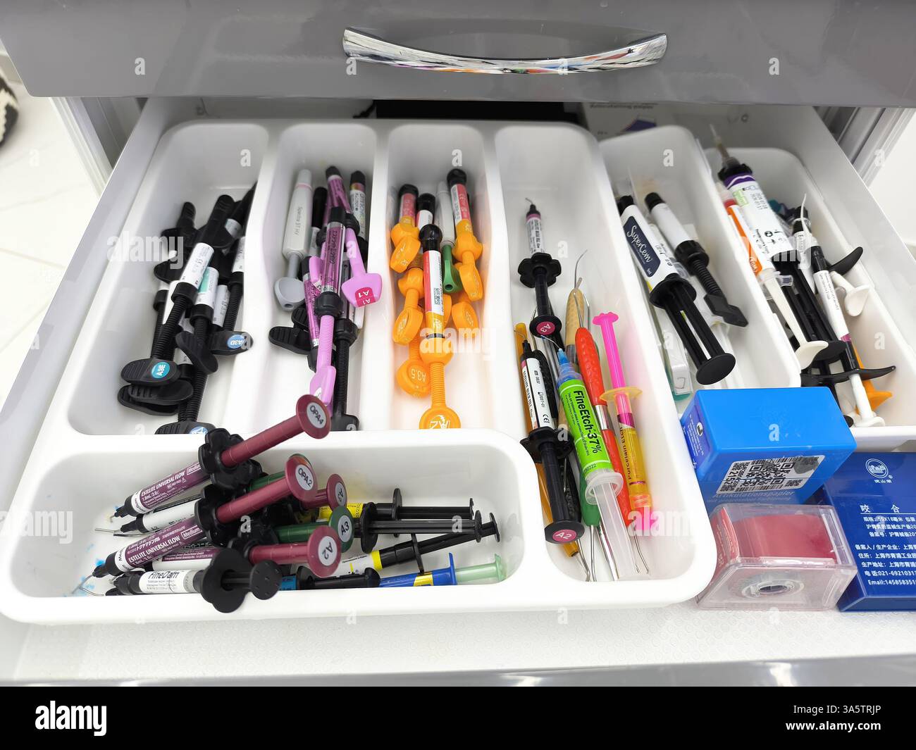 Dental supplies in organized drawer with syringes and tools Stock Photo ...