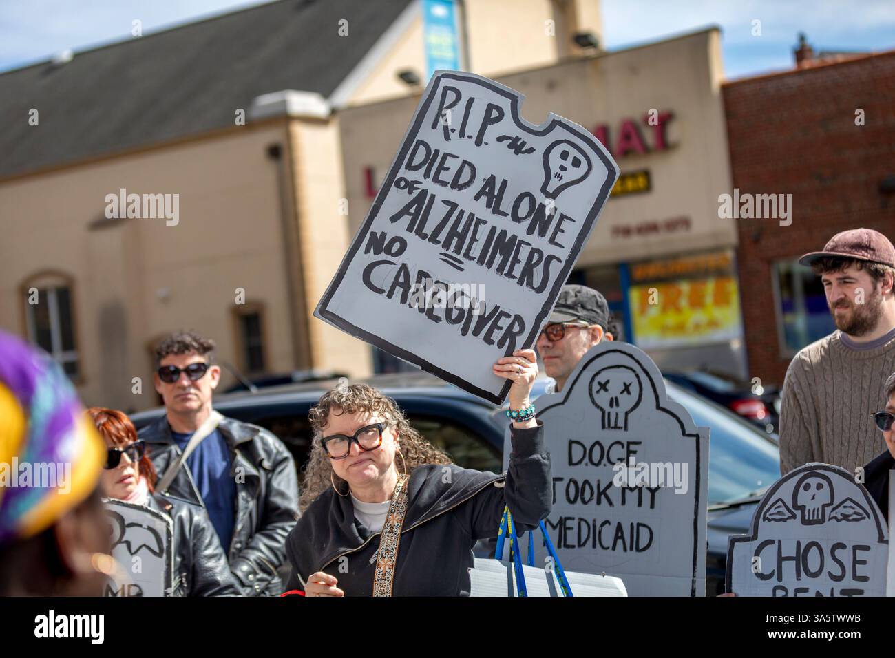 NEW YORK, NEW YORK - MARCH 22: A protestor with a sign that reads "RIP ...
