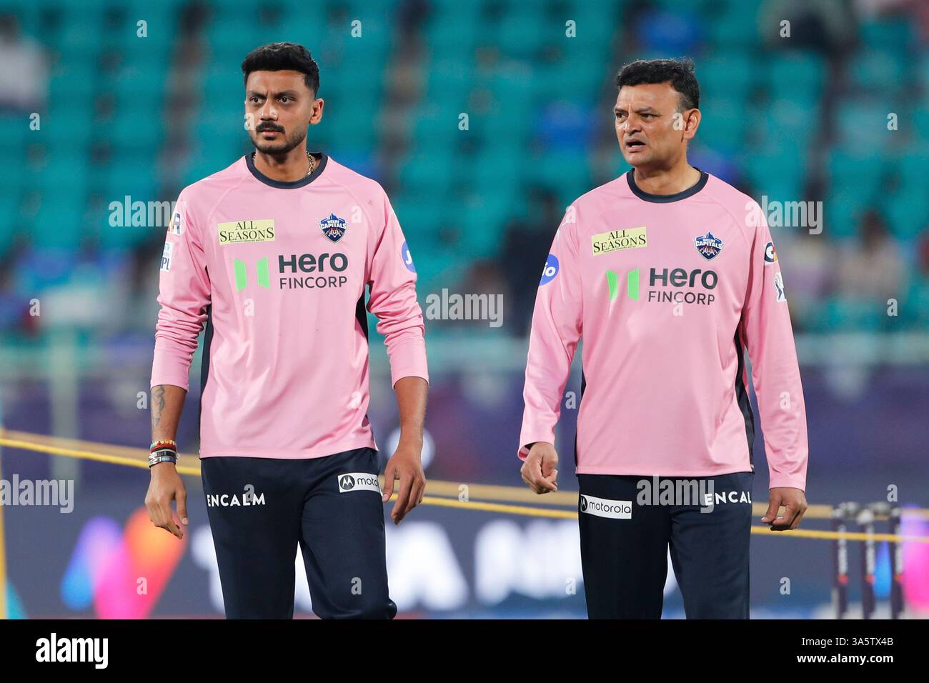 Delhi Capitals coach Hemang Badani, right, with captain Axar Patel inspect the pitch at the ...