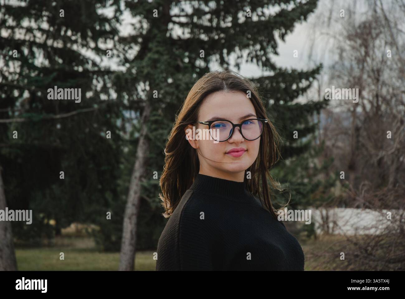 Portrait of a woman in nature with glasses and sweater. Glasses for ...