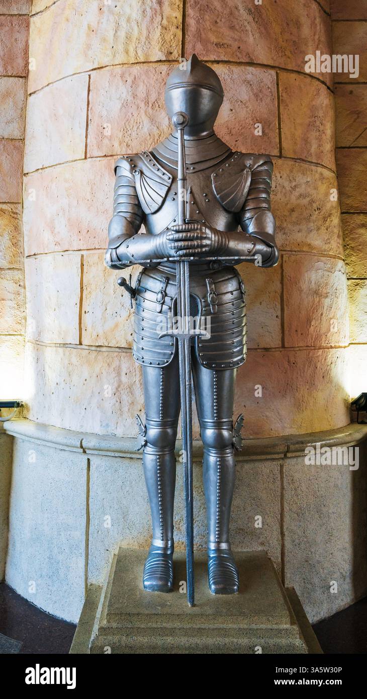 statue of a medieval knight in metal armor armed with a sword Stock ...