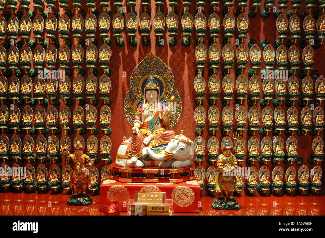 Singapore, Singapore - May 8, 2009: A vibrant Buddhist shrine displays ...