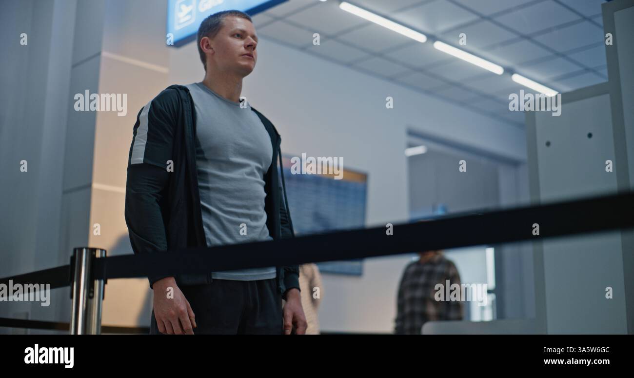 Security Checkpoint in Airport Terminal: Young Man with Prosthesis Leg ...