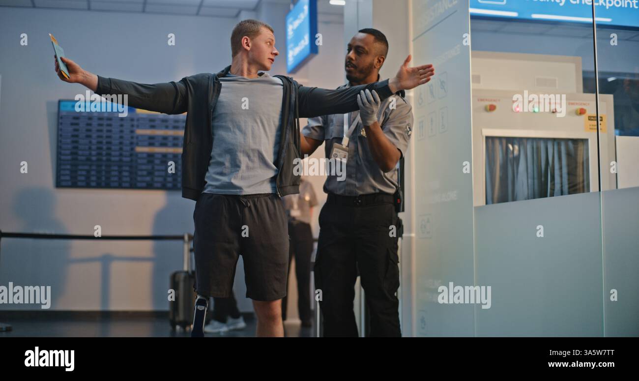 Security Checkpoint: African American TSA Officer Checking Young Man ...