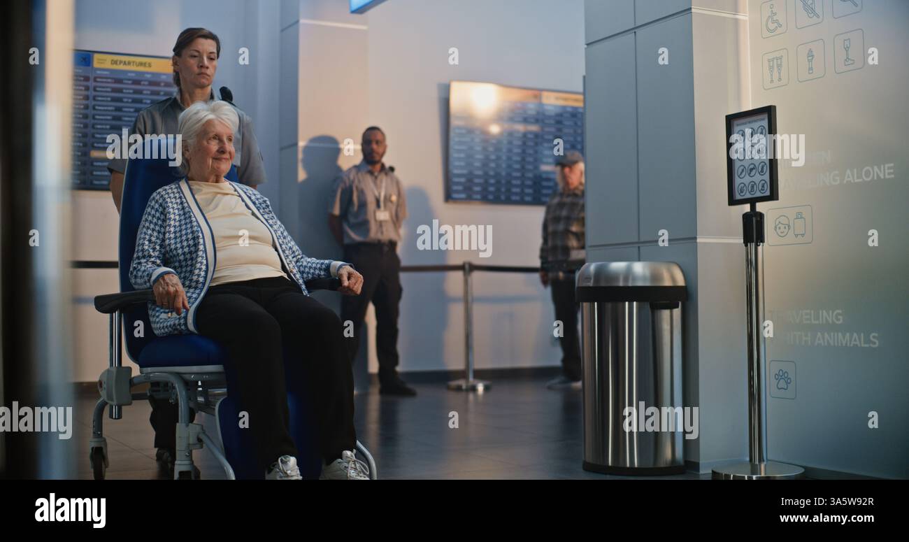 Security Checkpoint: Female TSA Officer Checking Elderly Woman Getting Up from Wheelchair in ...