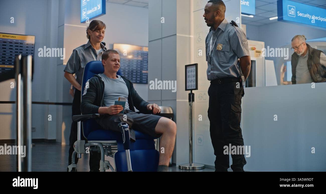 Security Checkpoint: African American TSA Officer Checking Man with ...