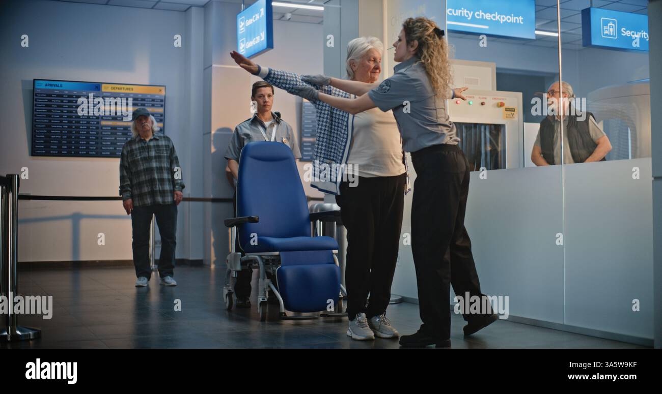 Security Checkpoint: Female TSA Officer Checking Elderly Woman Getting Up from Wheelchair in ...
