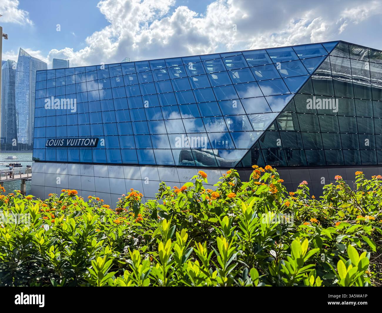 The Louis Vuitton island maison store in Singapore is a glass building ...