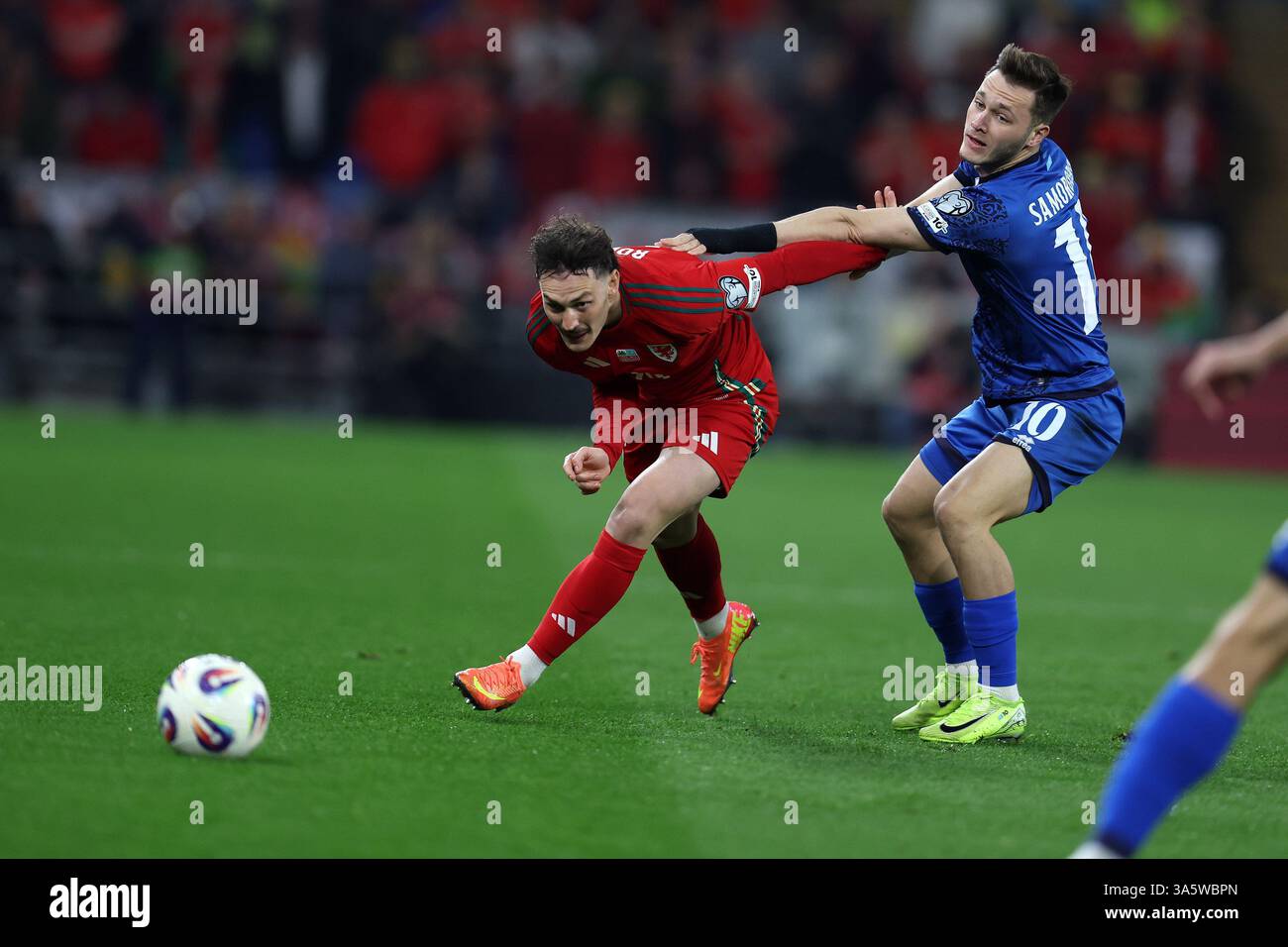 Cardiff, UK. 22nd Mar, 2025. Connor Roberts of Wales (l) in action ...