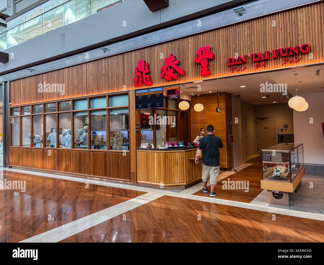 Din Tai Fung restaurant in Singapore with chefs visible inside the ...